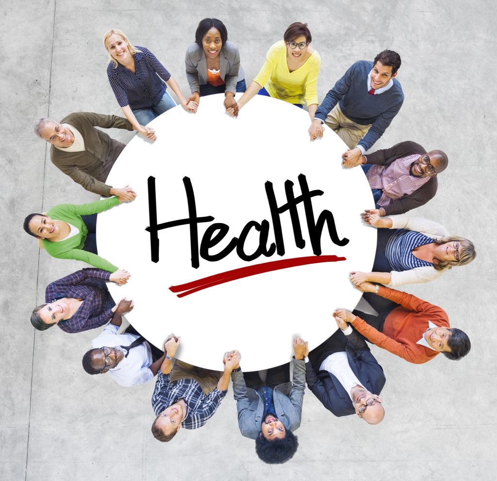 Group of People Holding Hands Around Letter Health - The Wellness Workshop